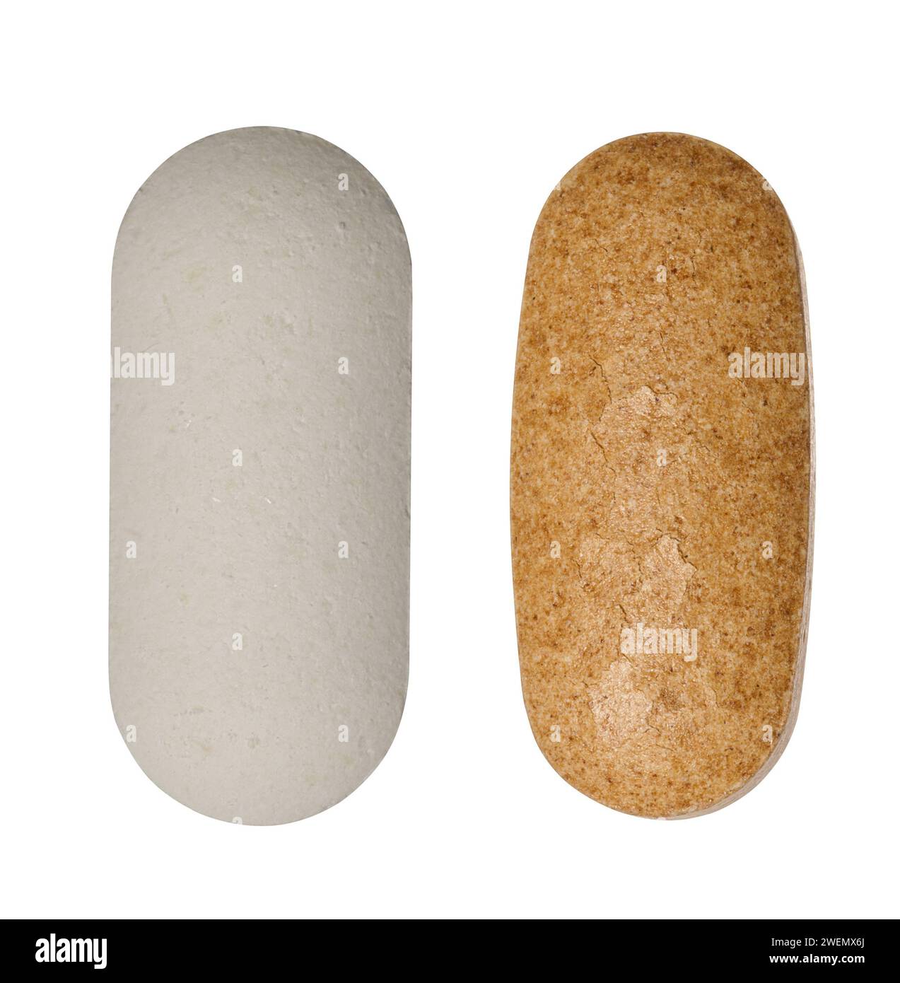 White and brown oval tablets on isolated background Stock Photo - Alamy
