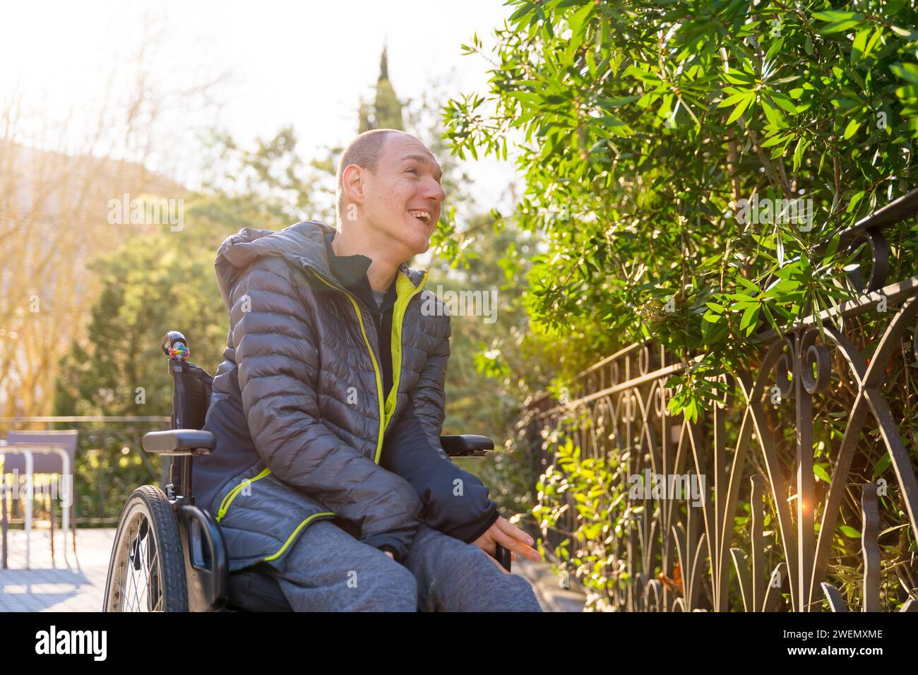 Low angle view portrait of a happy disabled man contemplating nature in ...