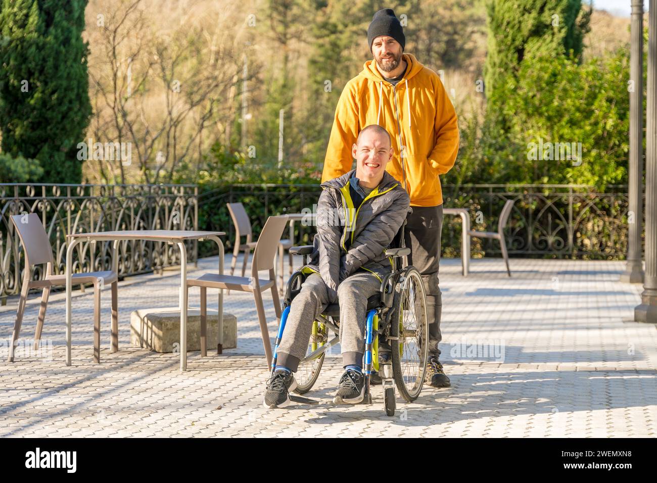 Portrait with copy space of a happy disabled man and friends in a sunny ...