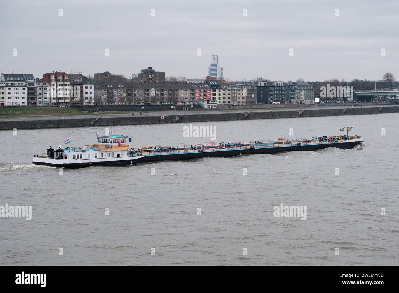 Cargo ship on the Rhine, historic city centre behind, Cologne, Germany ...