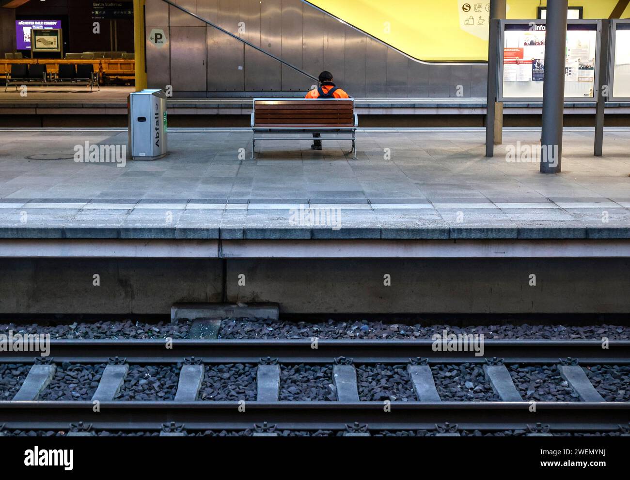 A passenger sits on a bench at Suedkreuz station. The fourth train ...