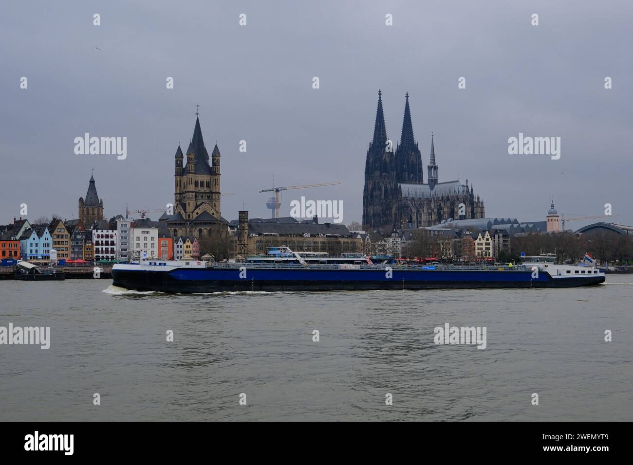 View over the Rhine with cathedral and cargo ship, Cologne, Germany ...
