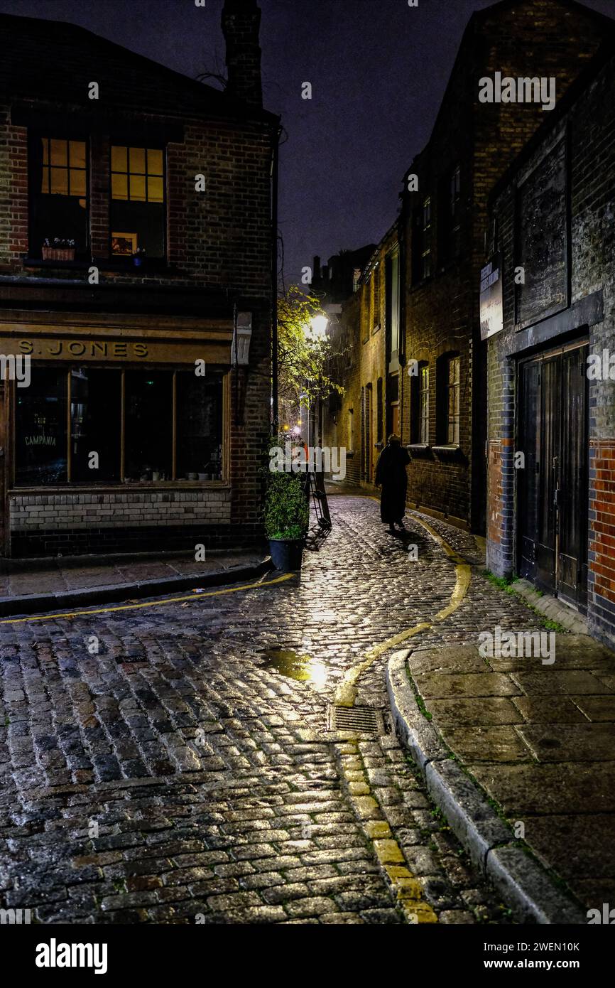 Person walking london street at night hi-res stock photography and ...