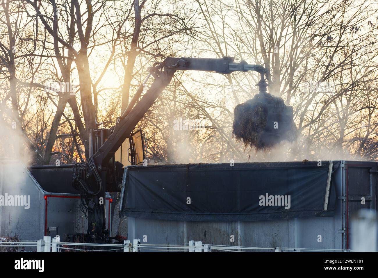 Modern truck crane arm loading trailer heap dung manure straw ...