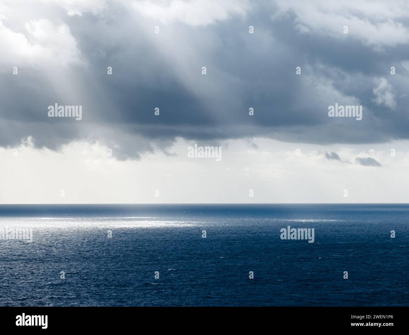 beams of lights hit the blue ocean Stock Photo - Alamy