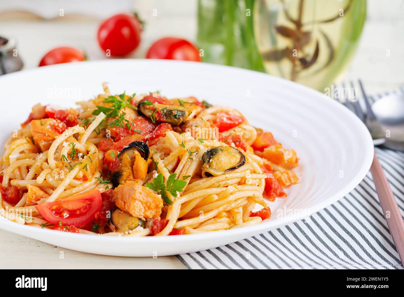 Classic italian pasta spaghetti marinara with mussels and salmon on ...