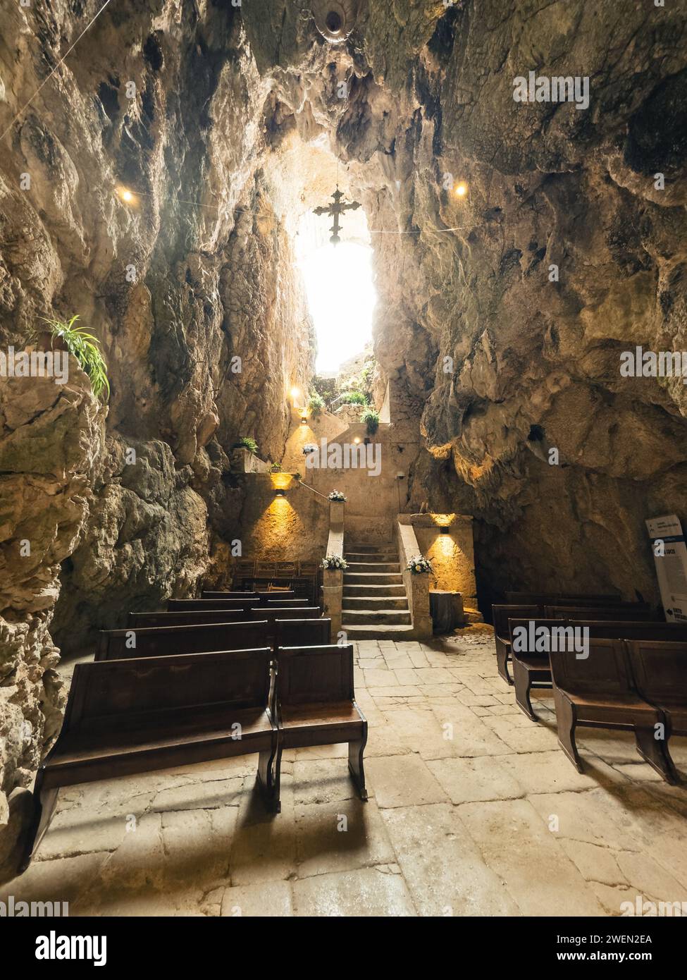 Catholic sanctuary in a old cave Stock Photo - Alamy