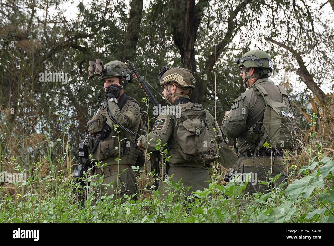 Israeli soldiers search a field after two explosive-laden drones were ...