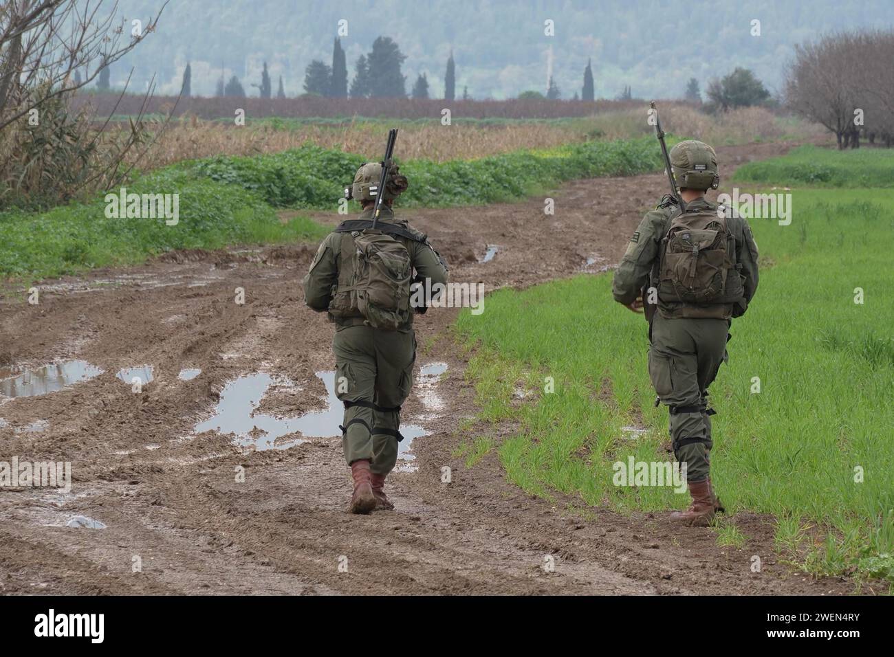 Israeli soldiers search a field after two explosive-laden drones were ...