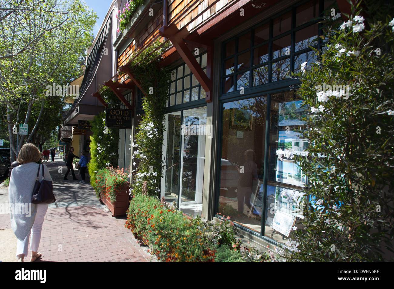 Storefronts along the sidewalk of Carmel By The Sea, Monterey ...