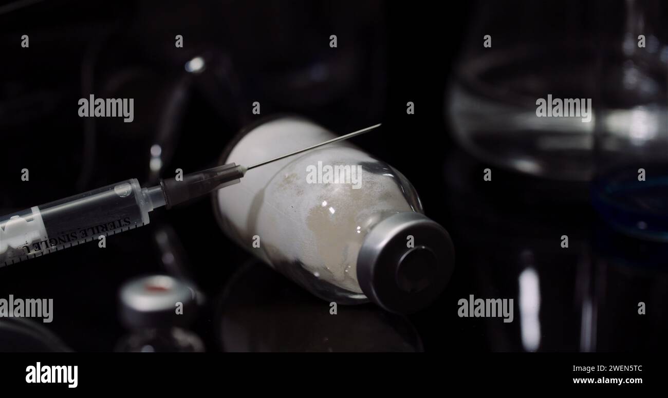 Laboratory Equipement: Syringe and Medicine, Test Tubes and Flasks ...