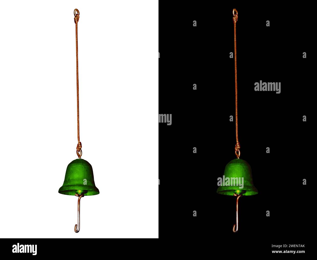 Green metal bell on a string on isolated white and black background ...