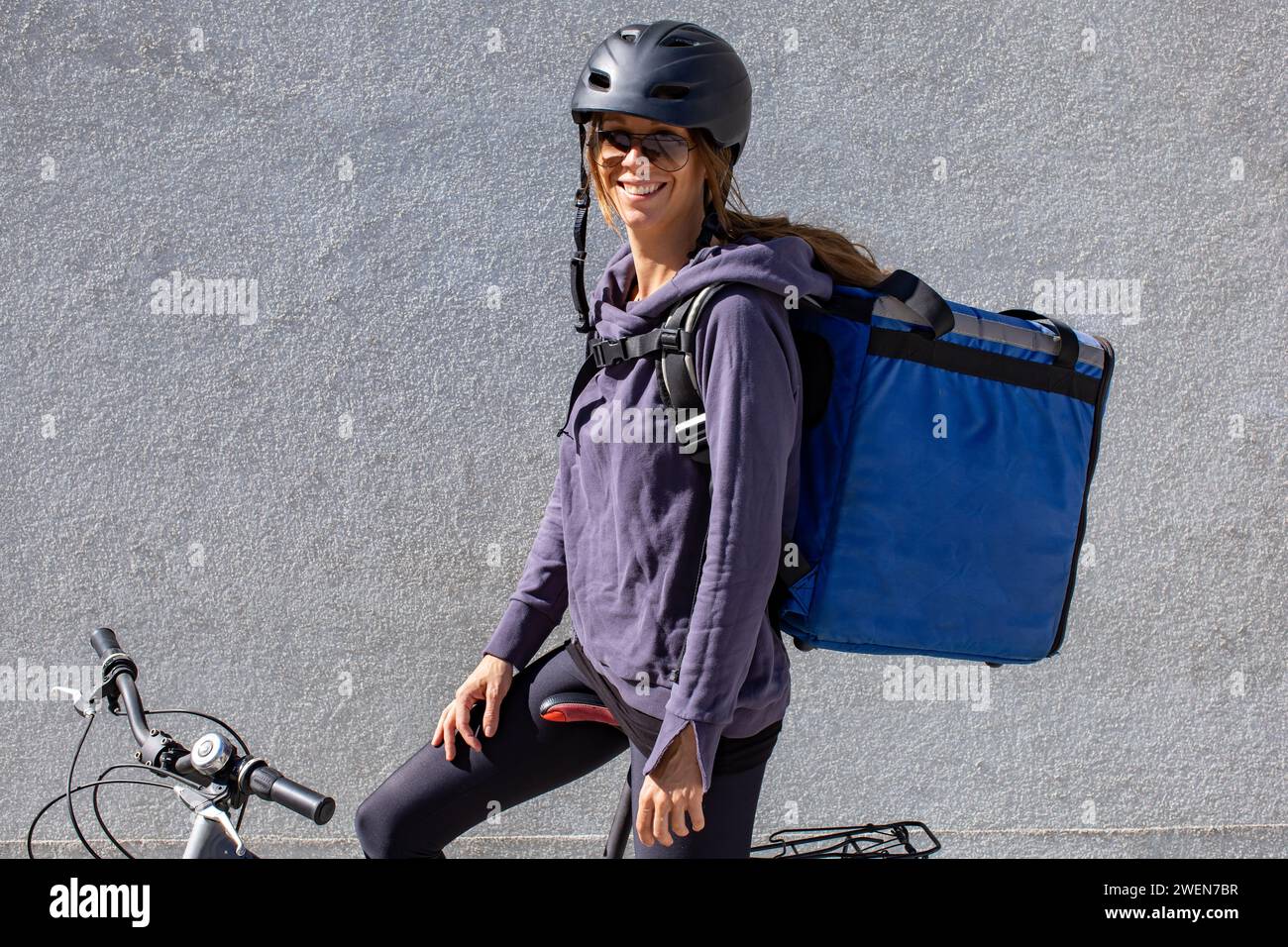 Woman riding fast bicycle hi-res stock photography and images - Alamy