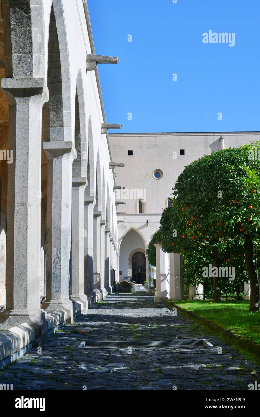 A garden in the ancient majolica cloister in the monastery Saint Claire ...