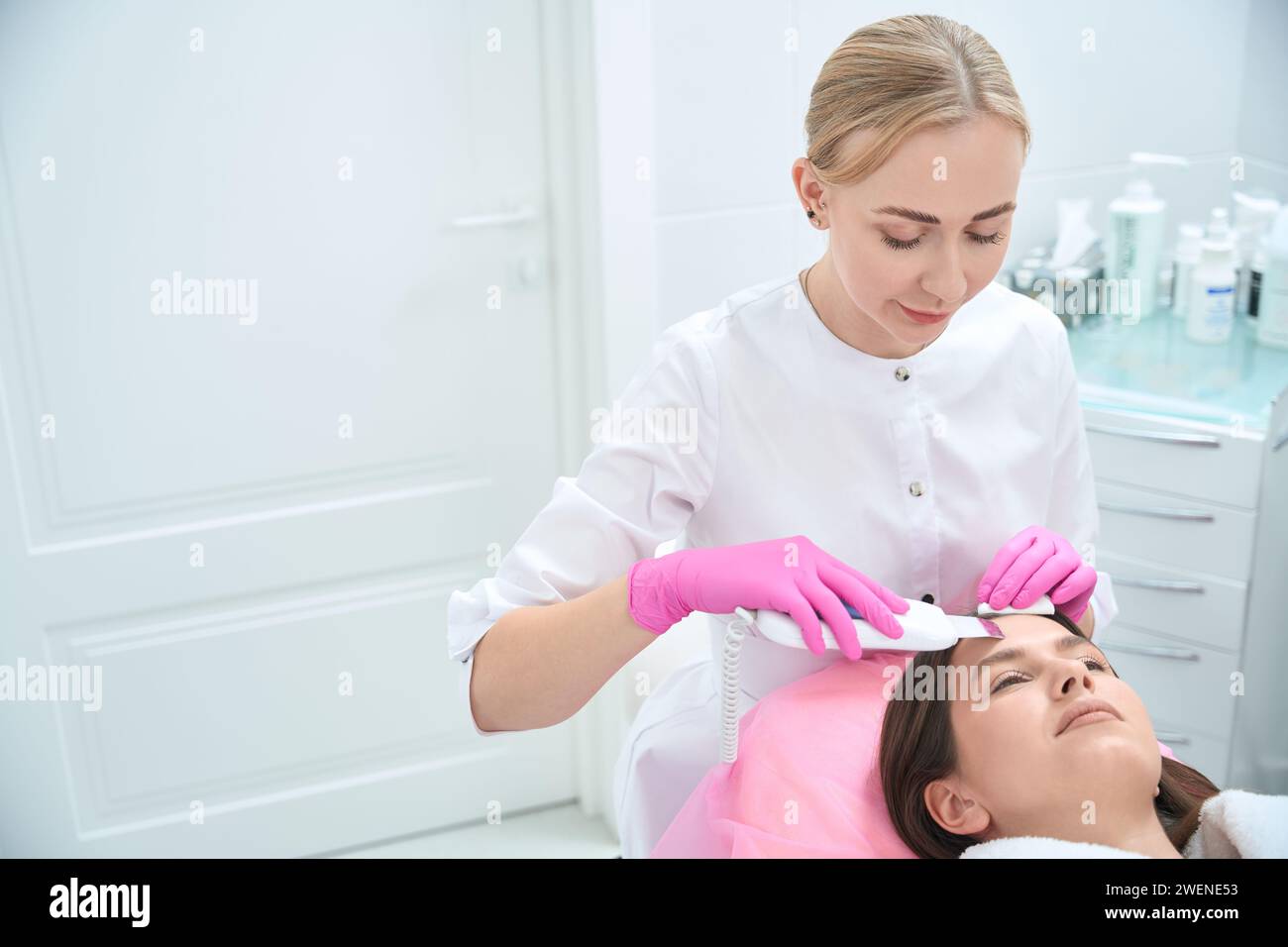 Professional procedure, skincare, female working with customer Stock Photo - Alamy