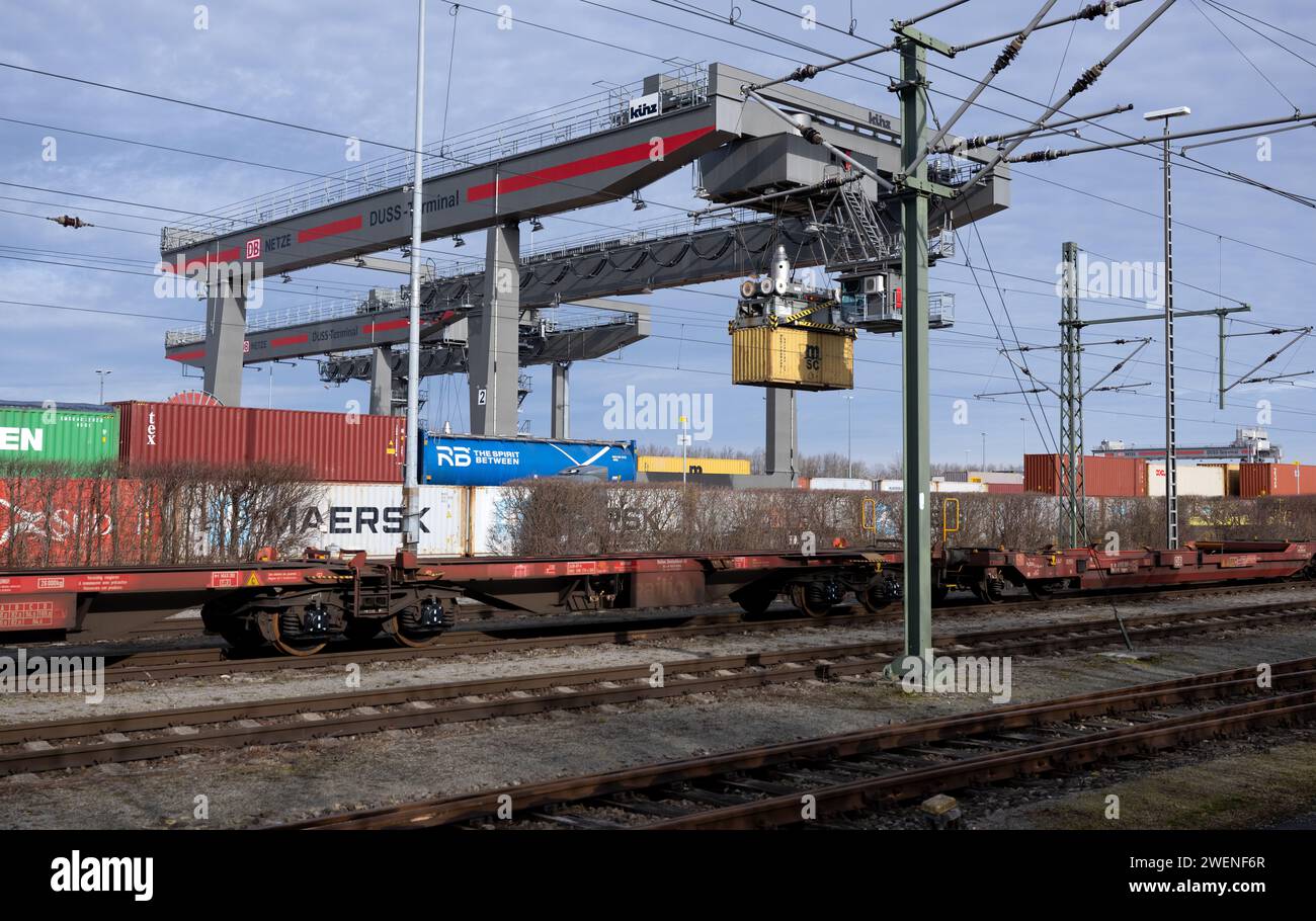 26 January 2024, Bavaria, Munich: Containers are loaded from freight ...