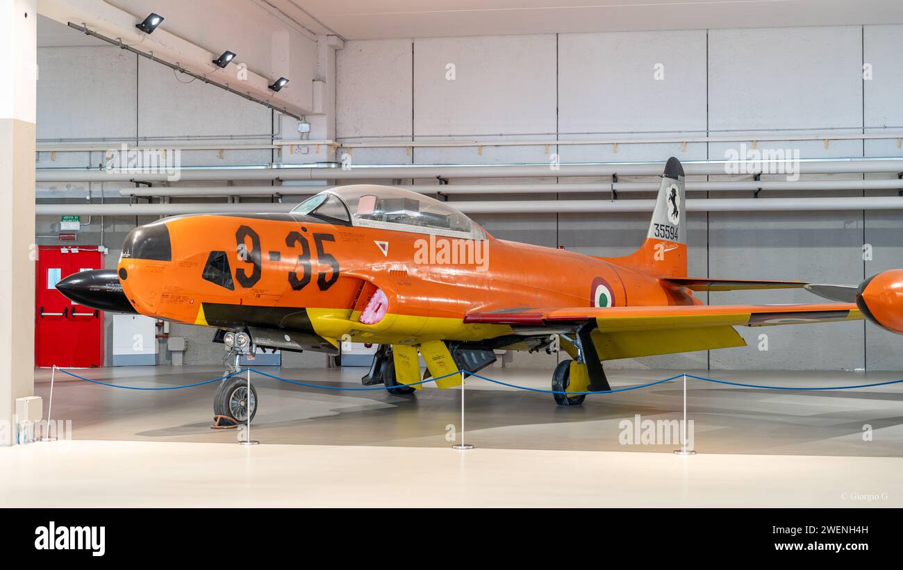 Vintage military air jet fighter with an orange bodywork in exhibition ...