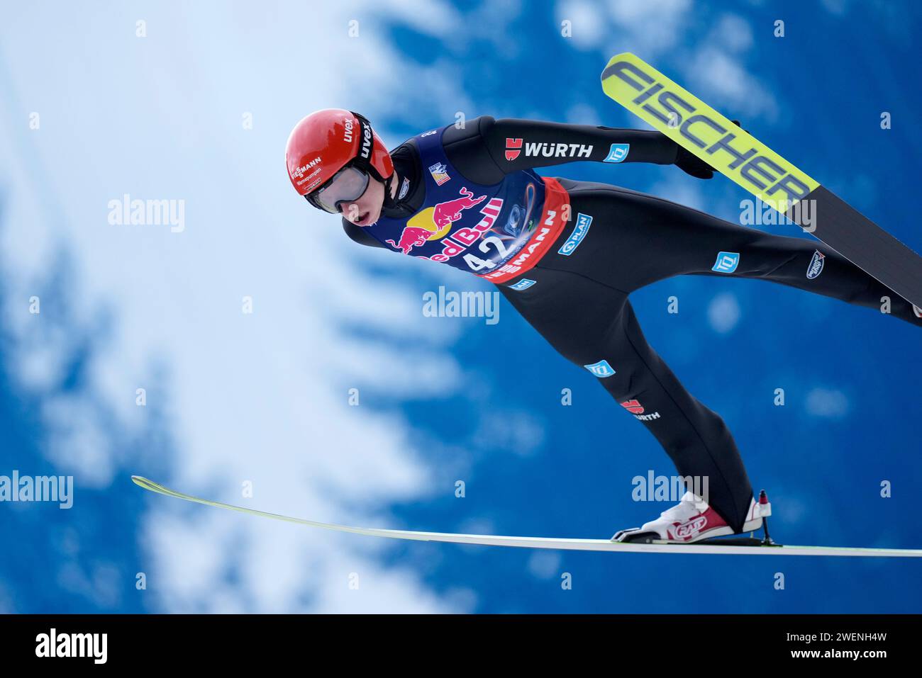 Karl Geiger, of Germany, soars through the air during his first round ...