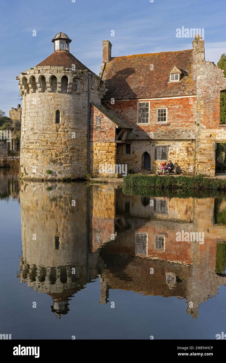 Scotney Castle ruins with water reflection on the castle moat ...