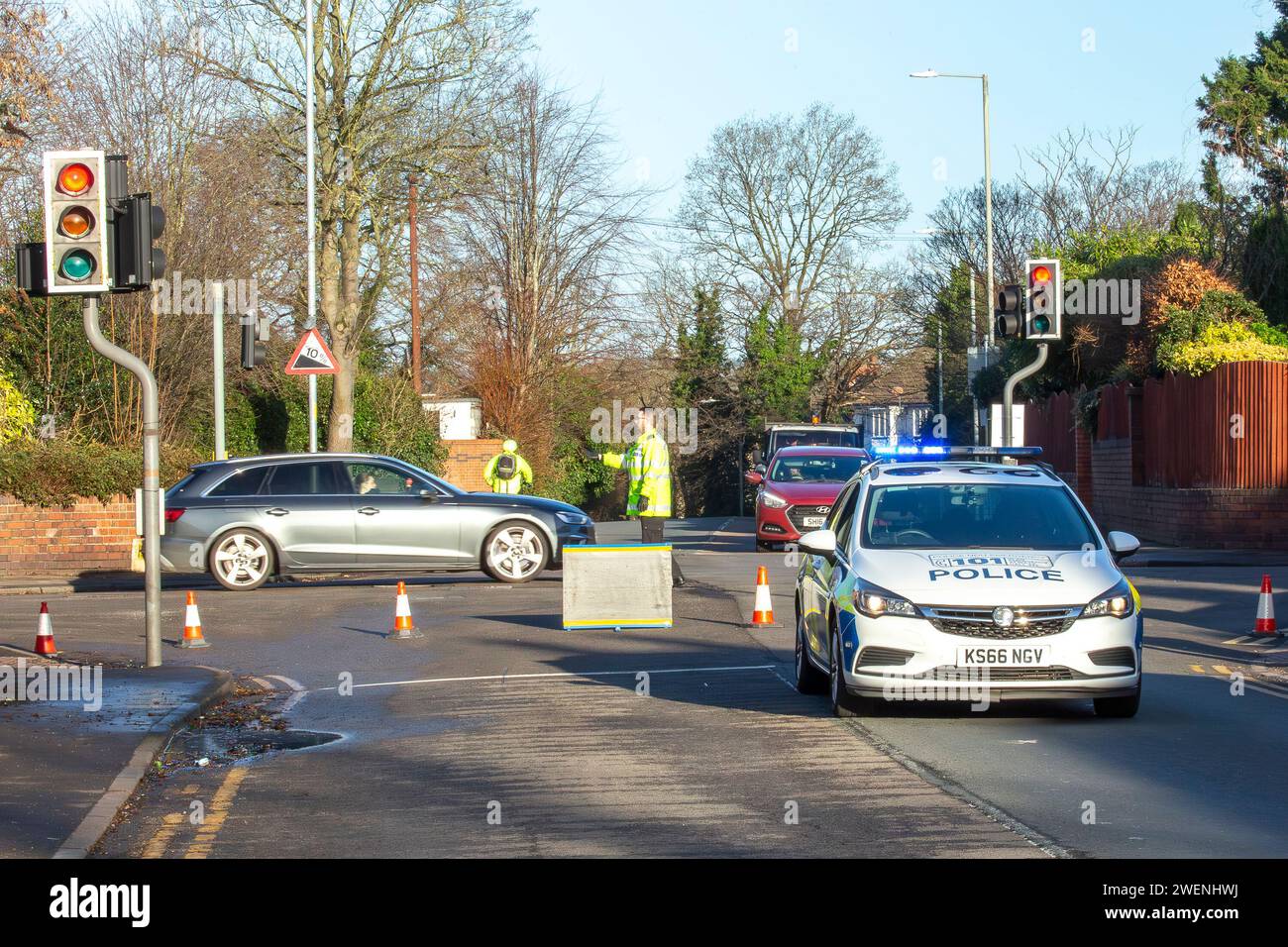 Front view of a West Mercia Police car with flashing blue lights and a ...
