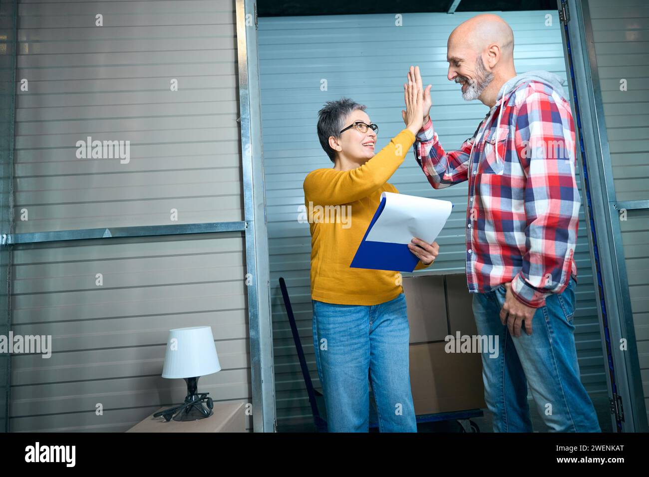 Woman high fiving husband hi-res stock photography and images - Alamy