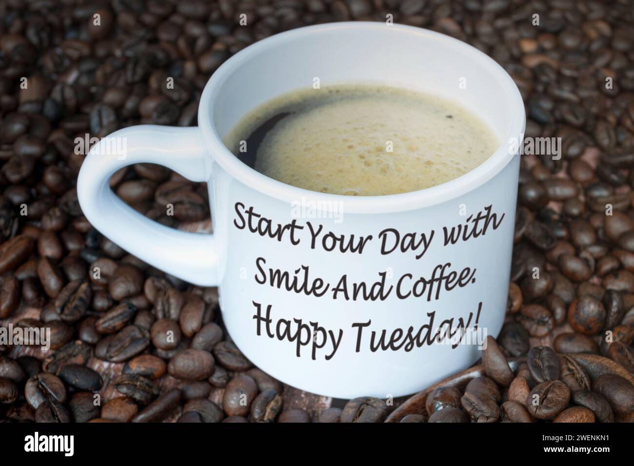 Motivational quote on a cup of coffee with beans background - Start ...