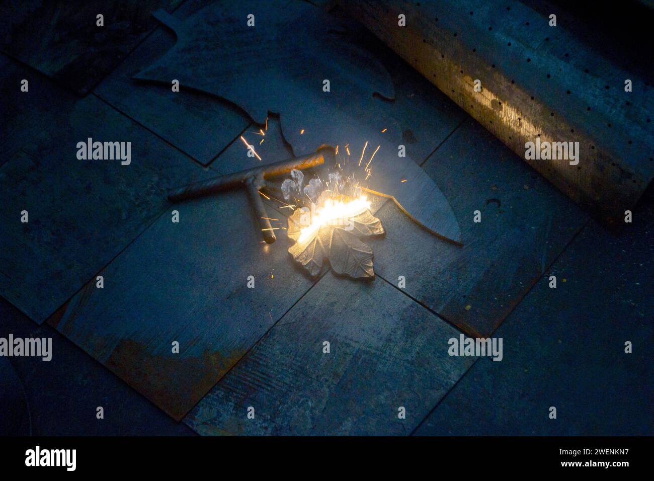 Laser cleaning of metal. The laser beam cleans the metal surface from ...