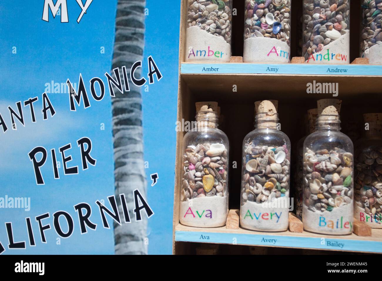 souvenir bottles of pebbles with names on each bottle on display on ...