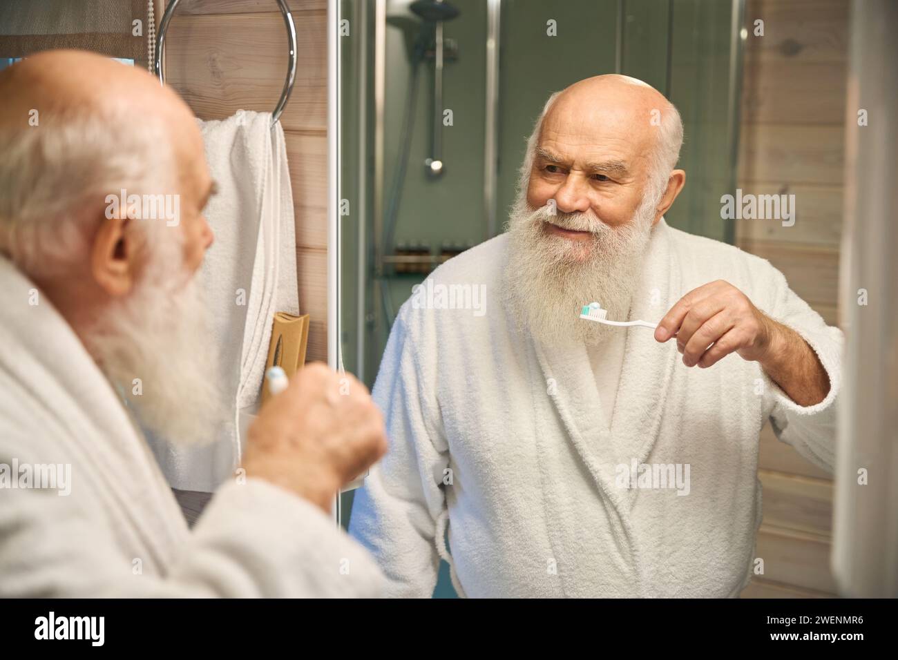 Old man doing his morning routine in the bathroom Stock Photo - Alamy