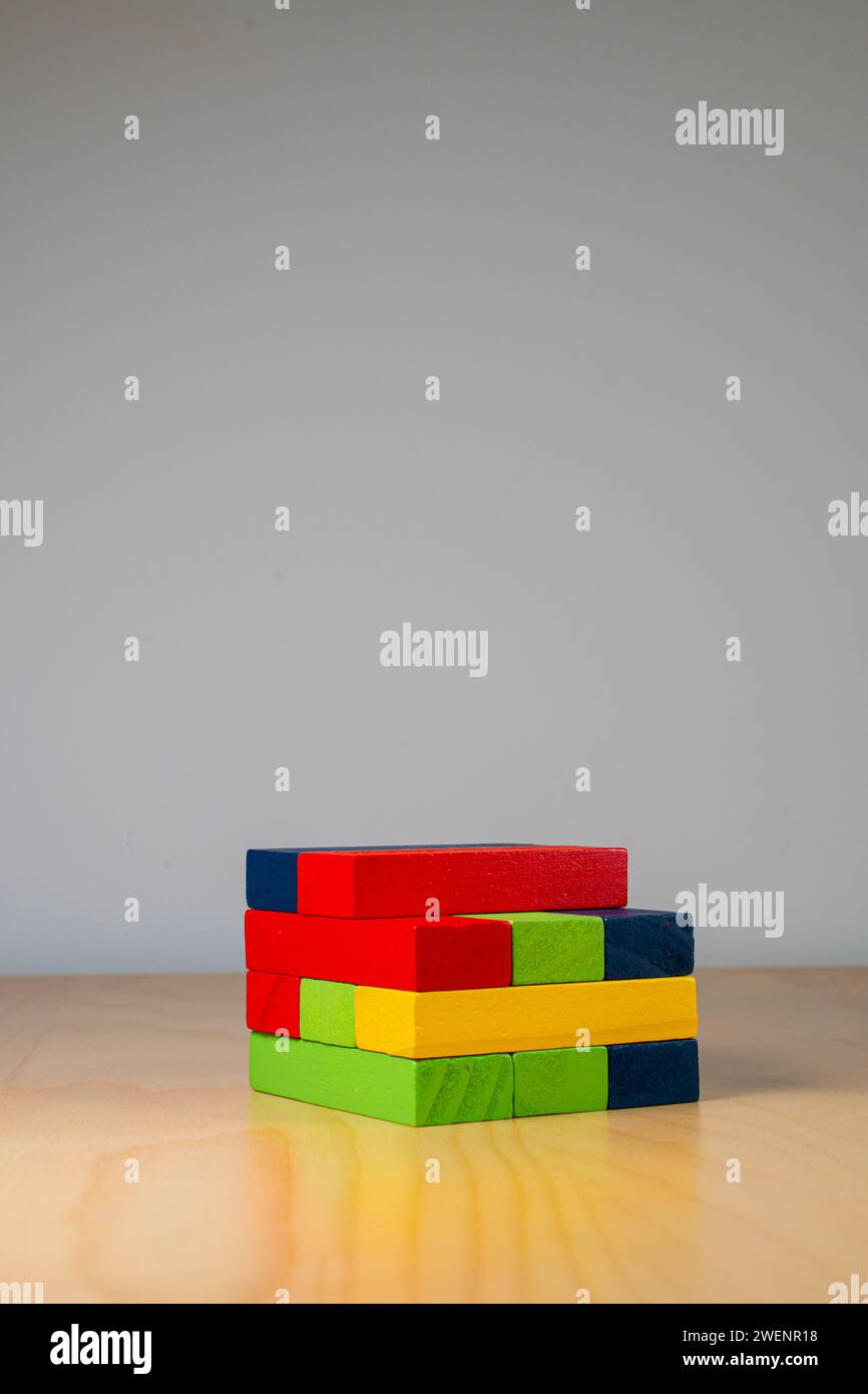 Wooden block tower under construction Stock Photo - Alamy