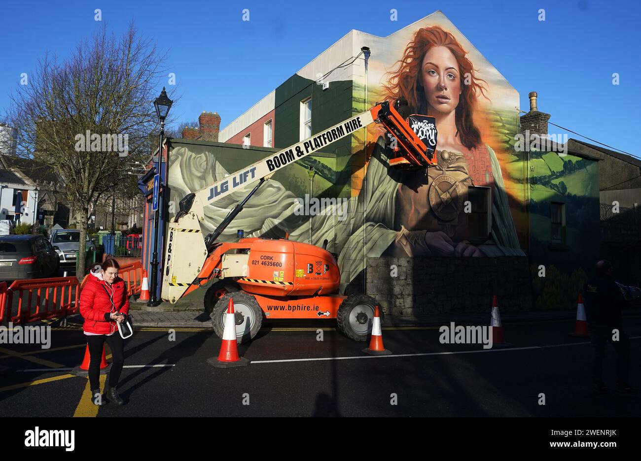 Street artist Mister Copy continues work on a mural depicting St ...