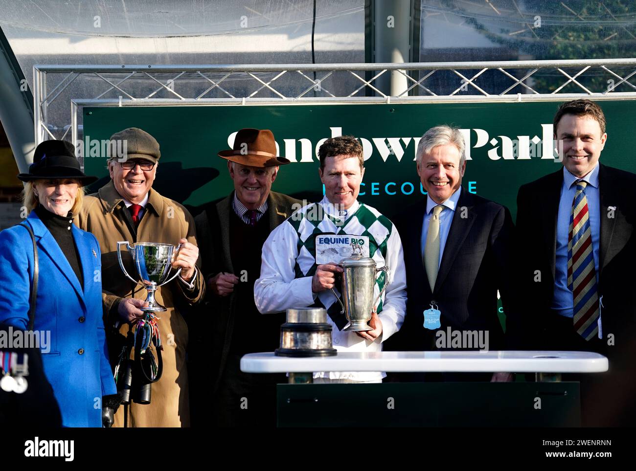 Major Charlie O'Shea (centre) poses for a photo with the trophy ...