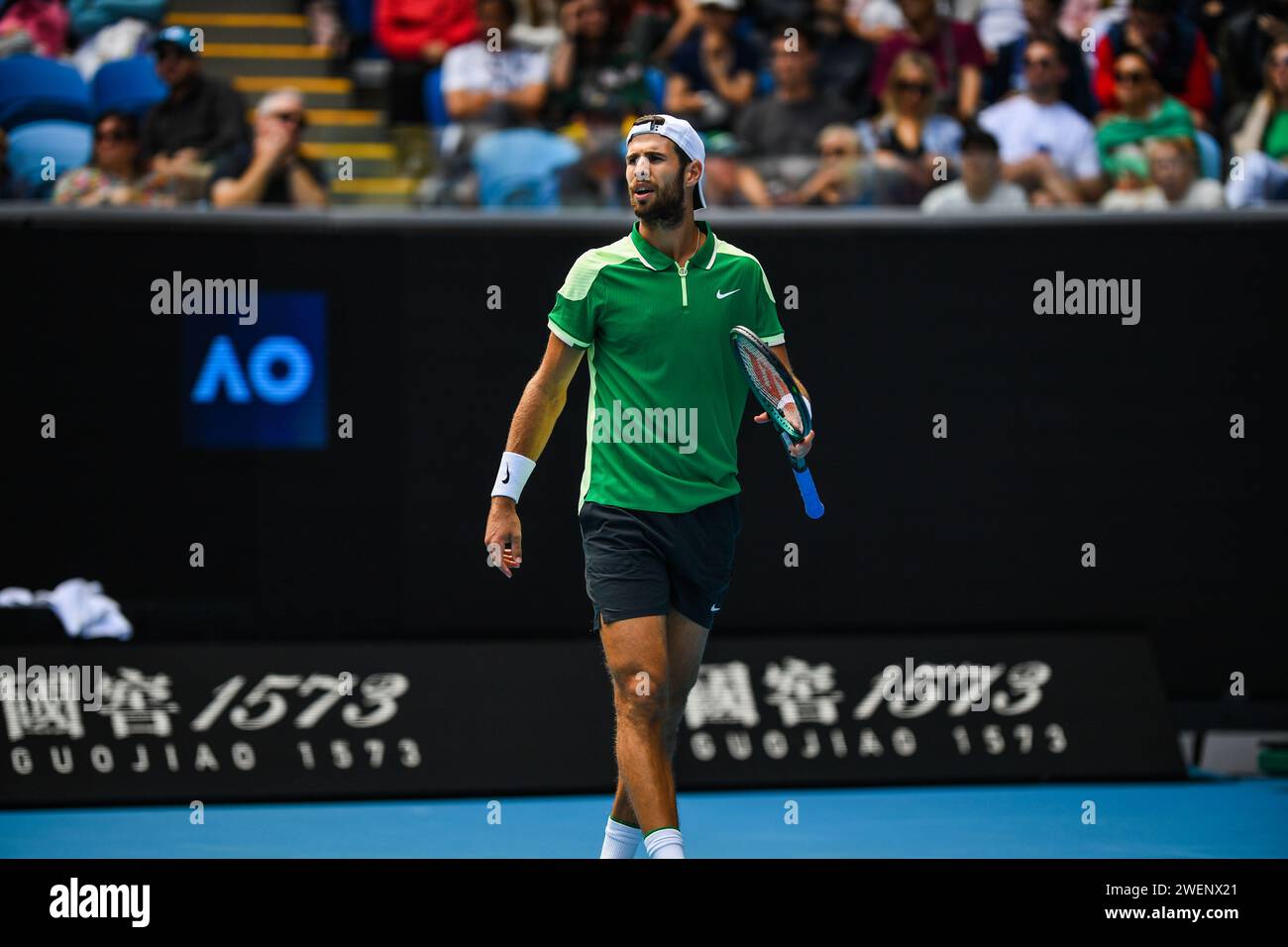 Melbourne, Australia. 21st Jan, 2024. Karen Khachanov of Russia plays against Jannik Sinner of ...