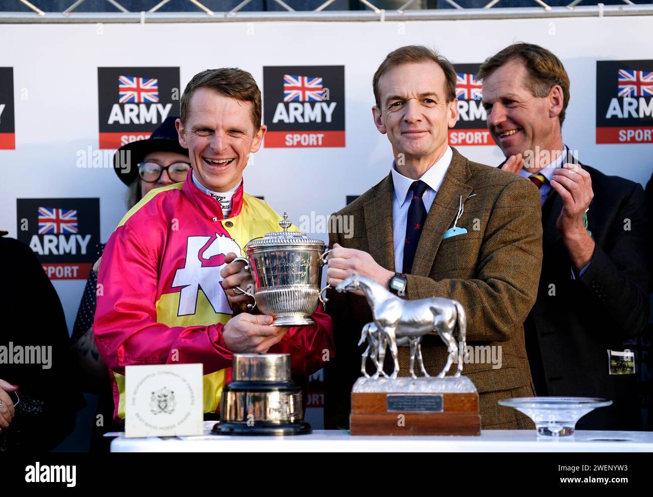 Major Will Kellard is presented with a trophy by Lieutenant General Charles Collins after ...