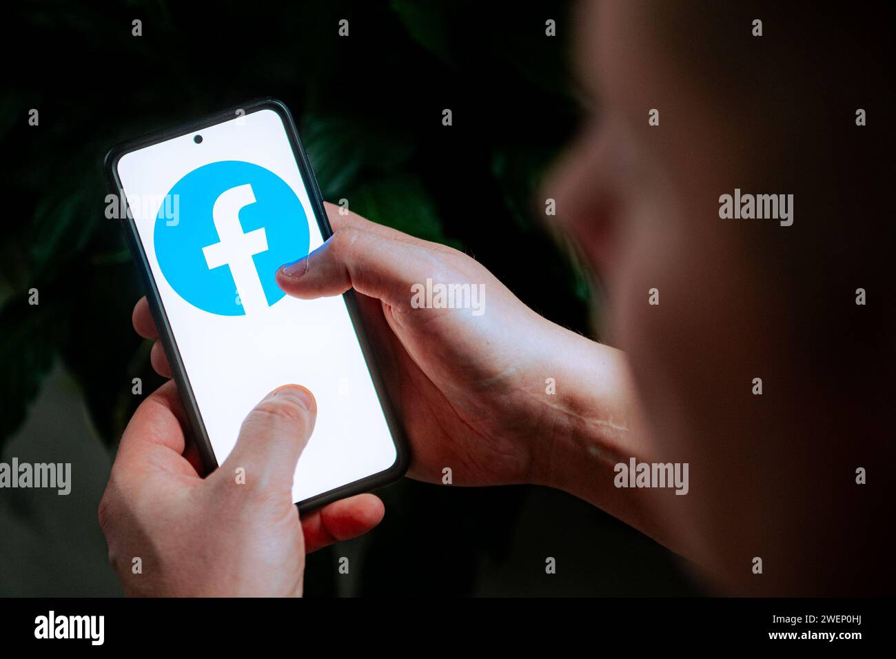 In this photo illustration a Facebook logo seen displayed on a ...