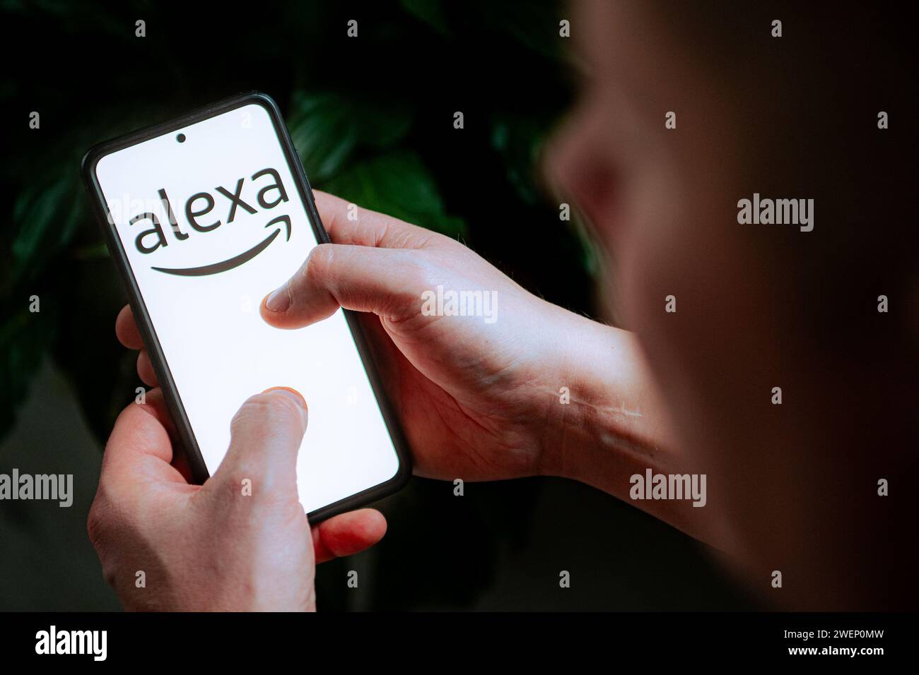In this photo illustration an Alexa logo seen displayed on a smartphone ...