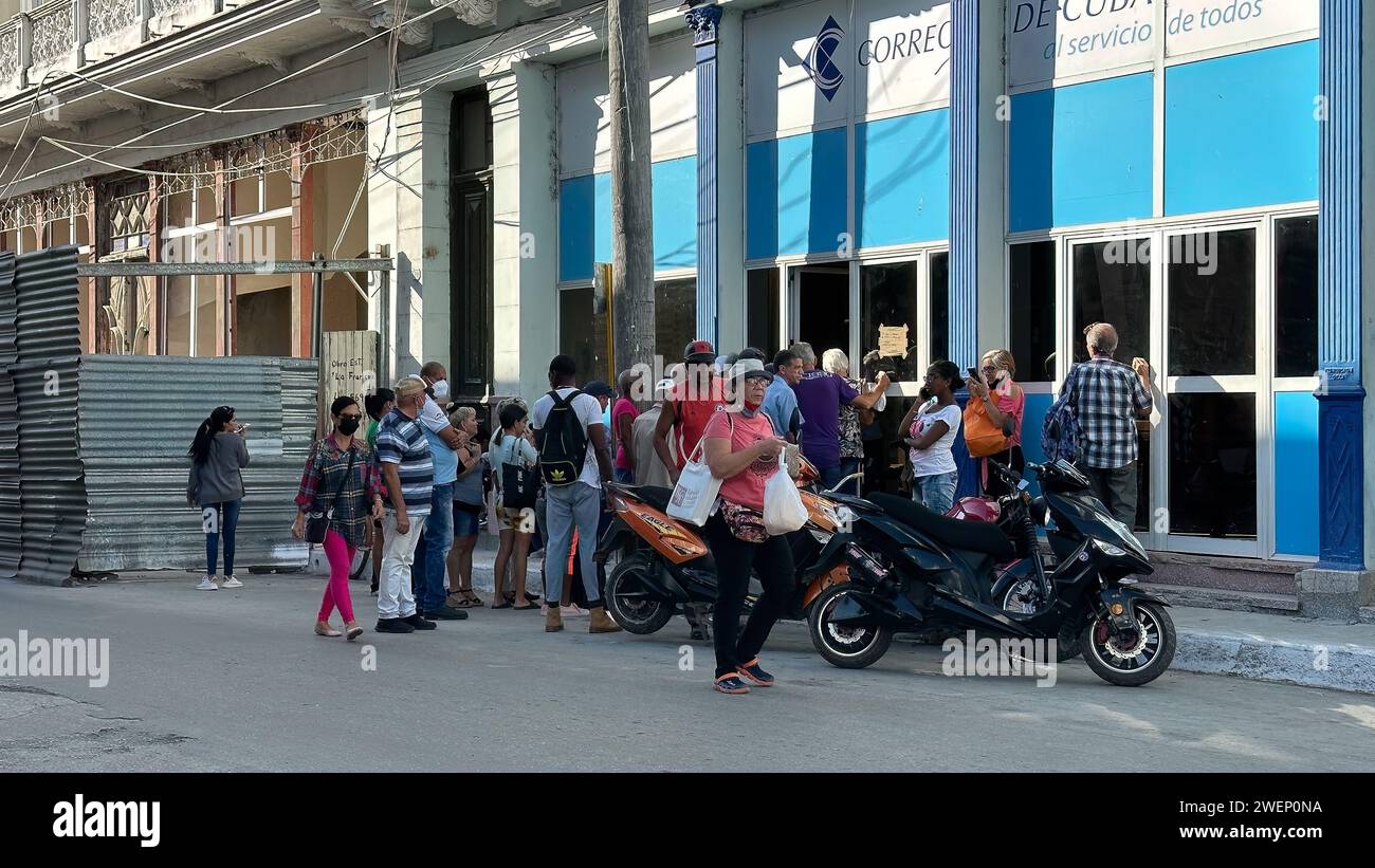 People waiting in line at post office buidling in Santa Clara, Cuba ...
