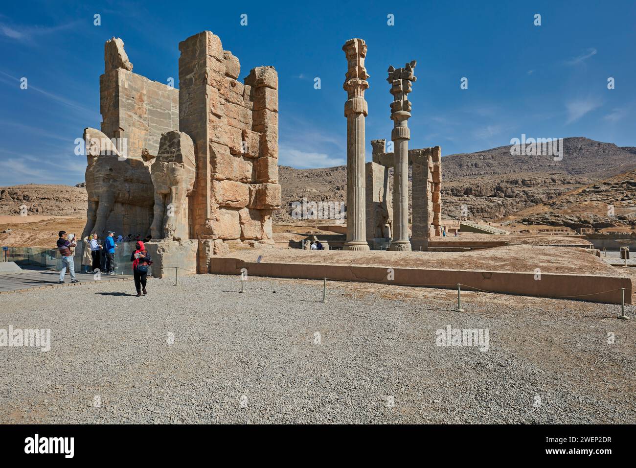 A group of tourists at the Gate of All Nations in Persepolis, an ...