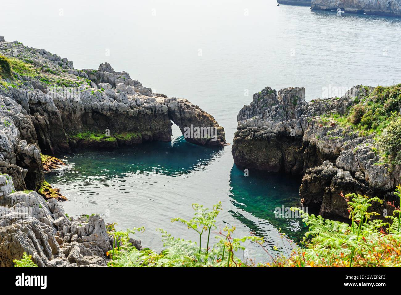 Striking layered rock formations along the rugged coast of Northern ...