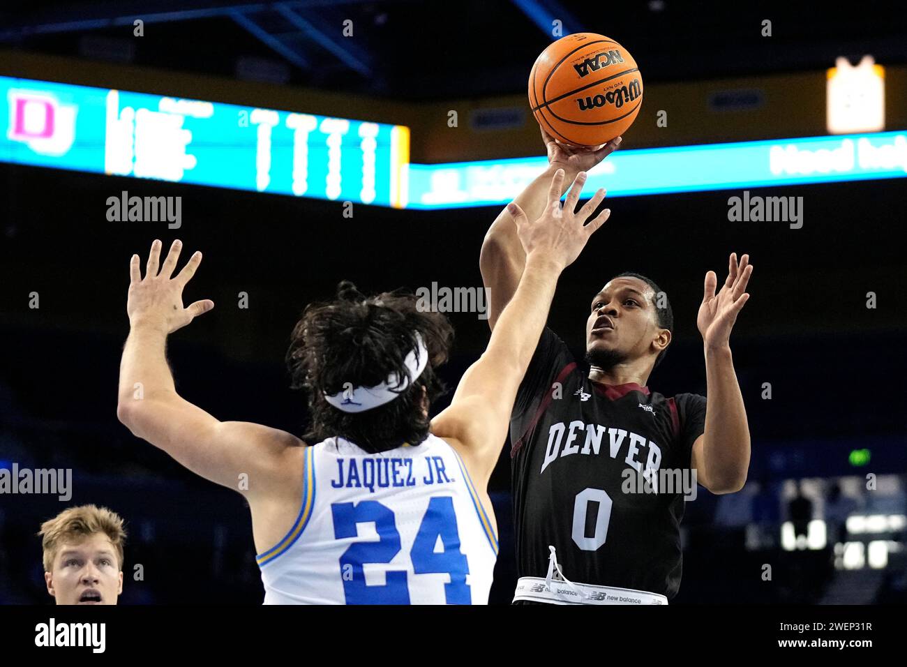 FILE - Denver guard Tommy Bruner, right, shoots as UCLA guard Jaime Jaquez Jr. defends during ...