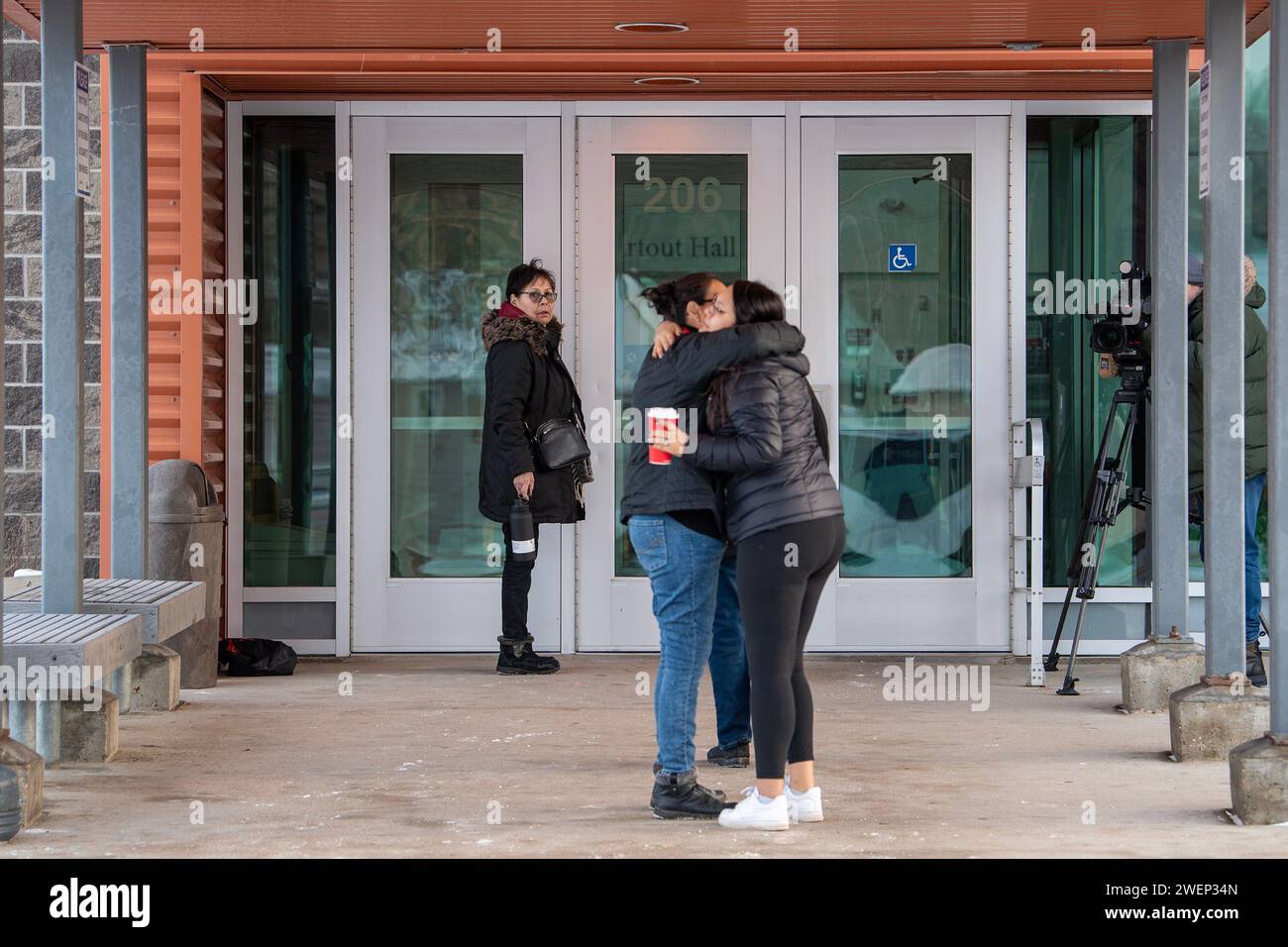 Melfort, Can. 26th Jan, 2024. People hug as they enter the public ...