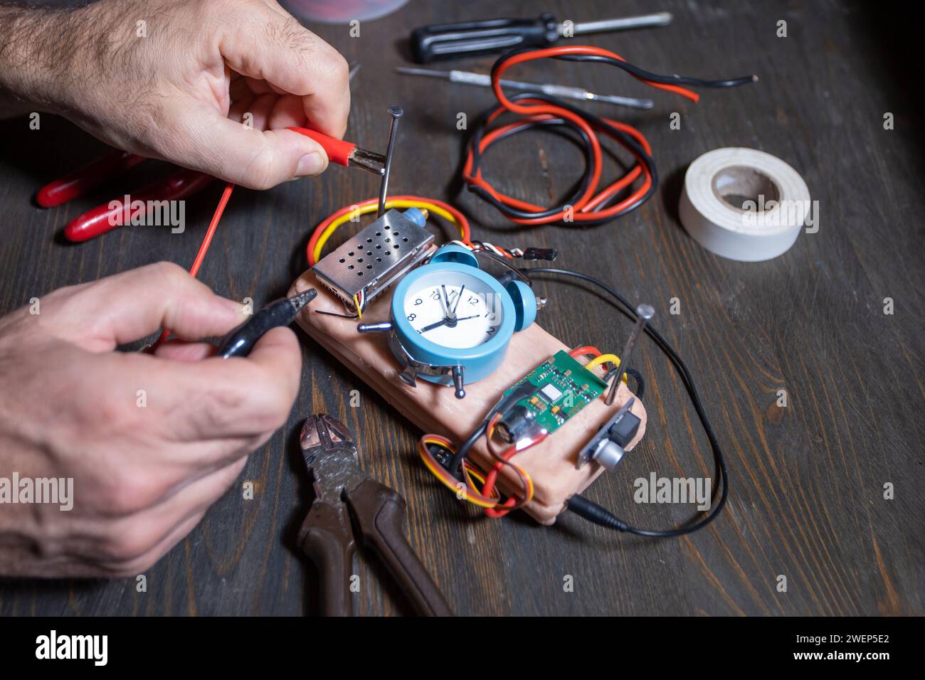 bomb maker constructing home made explosive Stock Photo - Alamy
