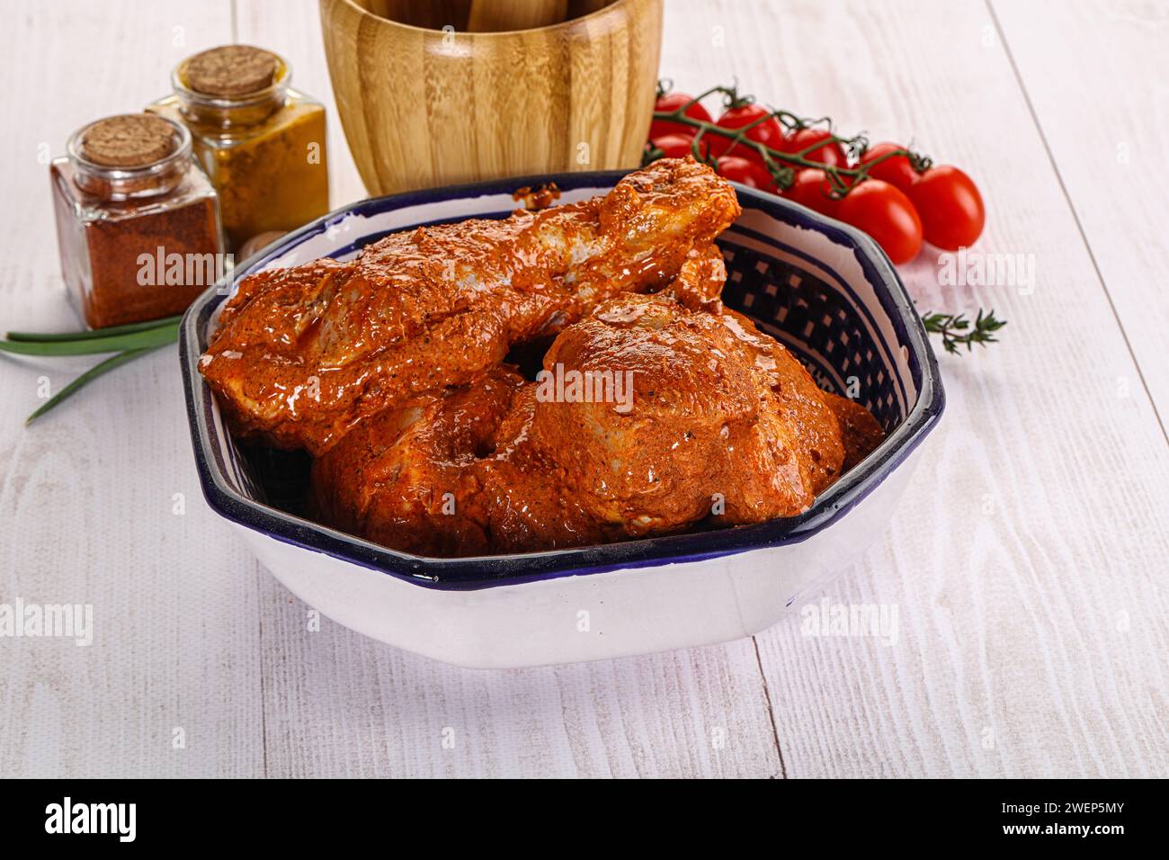 Raw turkey shoulder wing in Indian tandoori marinade spices Stock Photo ...