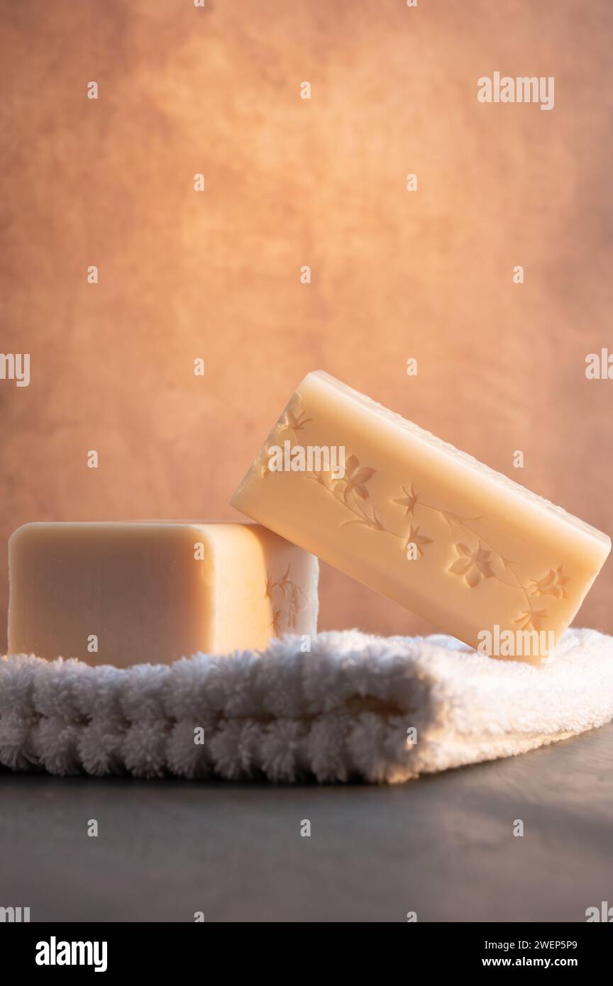 Two cream colored bars of soap on a gray counter Stock Photo - Alamy