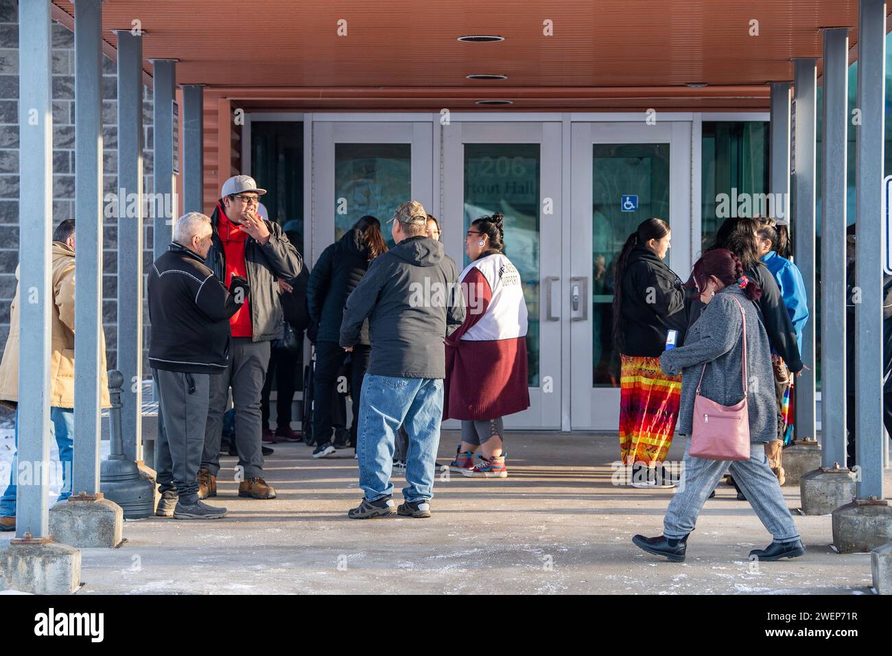 People gather during a morning break in the public coroner's inquest ...