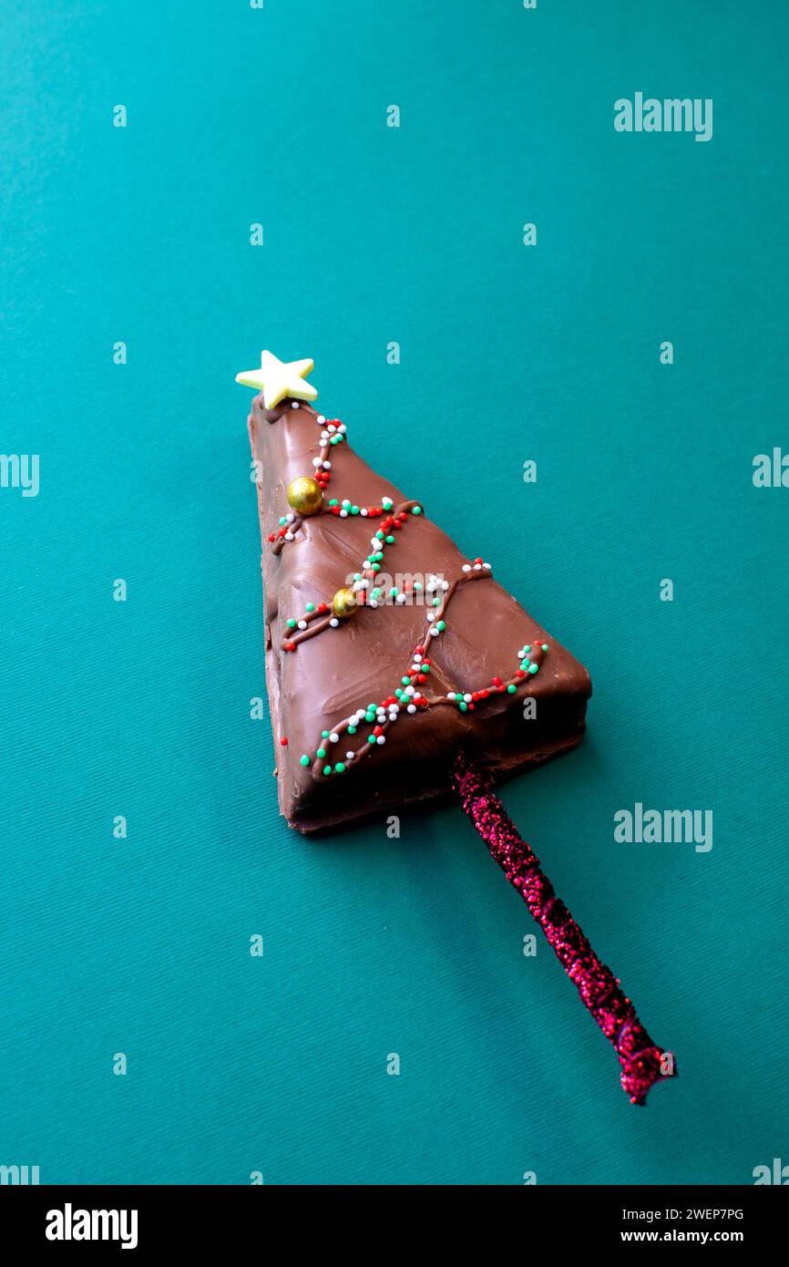 christmas tree shaped chocolate cakes on stick Stock Photo - Alamy