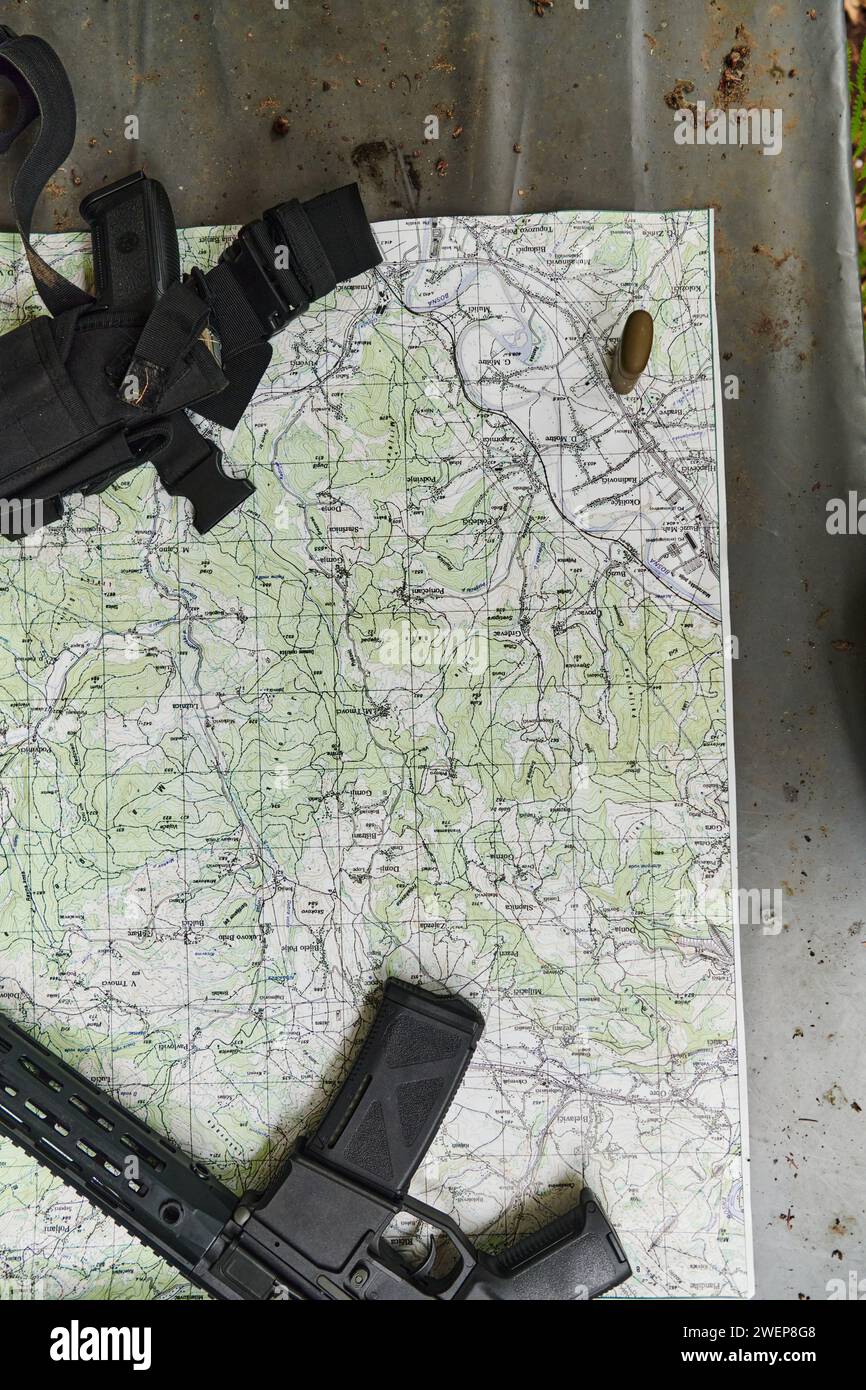 An array of military weapons, including rifles and pistols, is ...