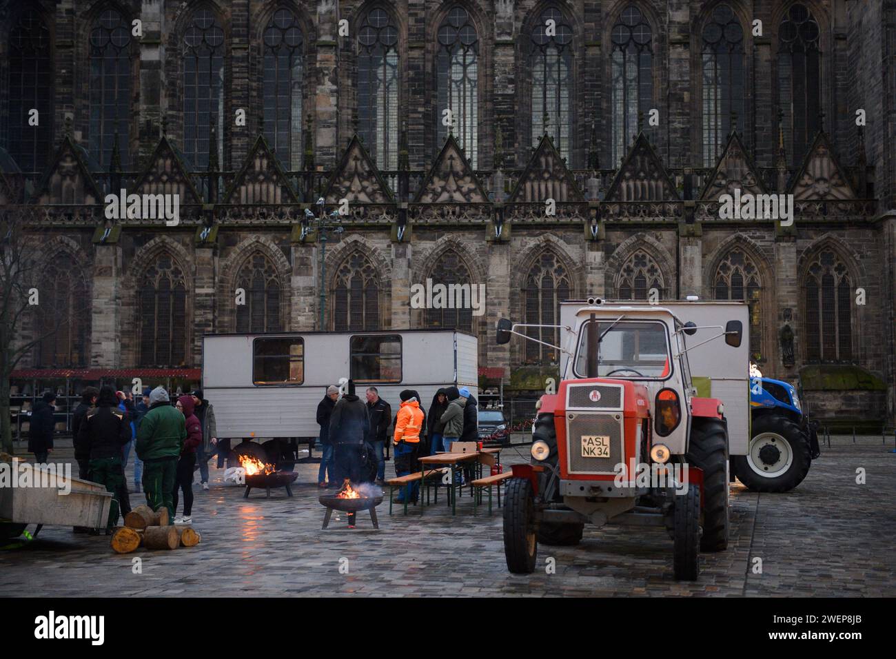 26 January 2024, Saxony-Anhalt, Magdeburg: Fires burn in fire bowls on ...