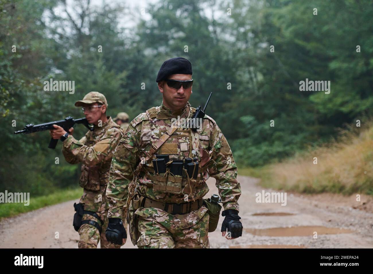 A disciplined and specialized military unit, donned in camouflage ...