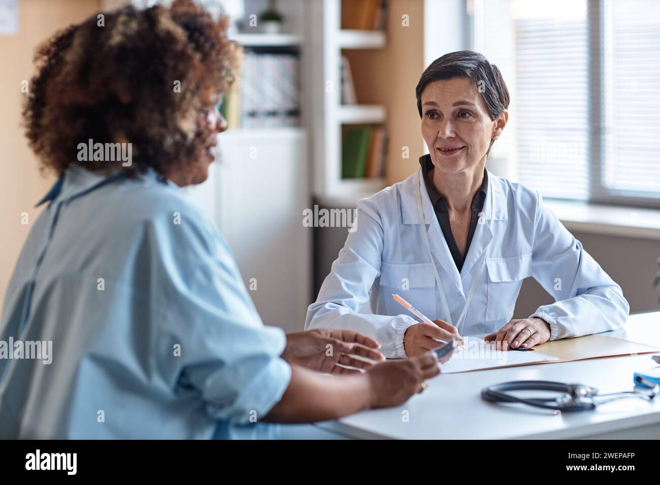 Friendly Female Obstetrician Talking to Patient Stock Photo - Alamy